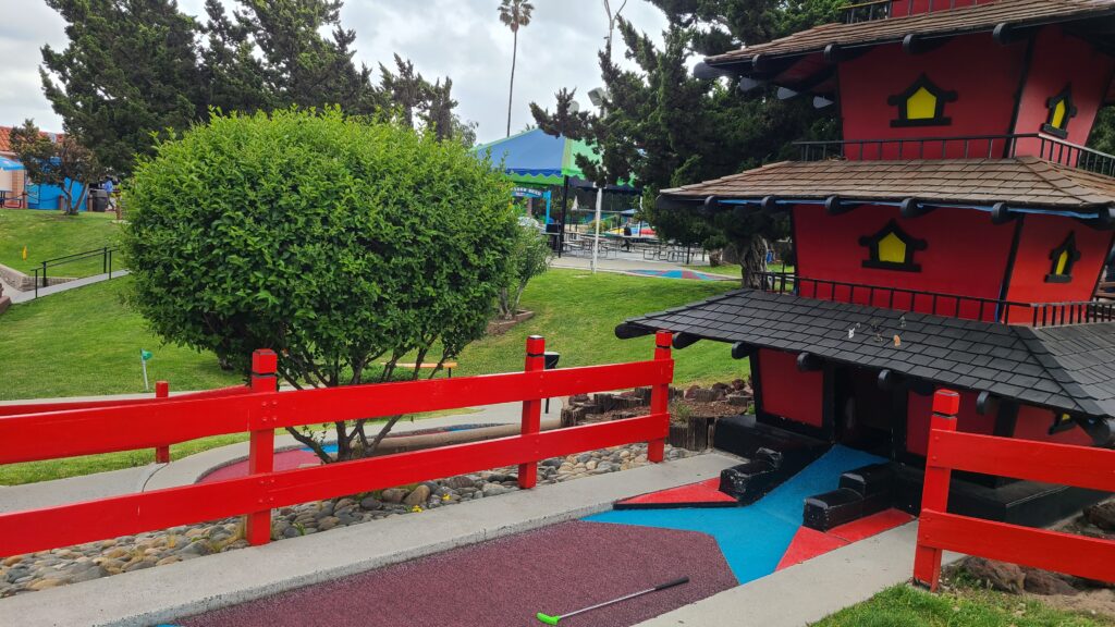 The little guys and pirates and knight play mini-golf at Golfland in ...